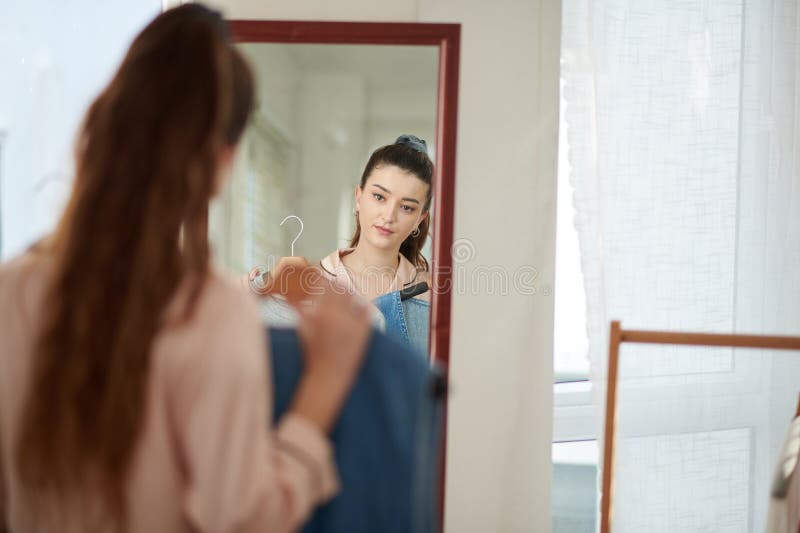 Girl Trying on Clothes stock photo. Image of female - 270723942