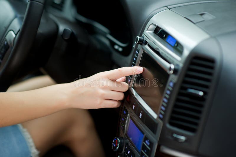 Girl Tunes in Radio Stations Using a Touchscreen on the Car Audio ...