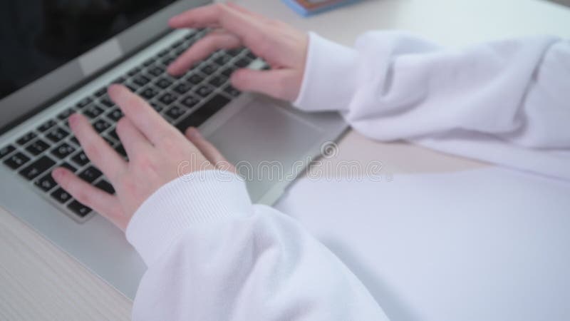 Girl Typing Text on a Laptop. Work at Home. Typing without Face Stock ...