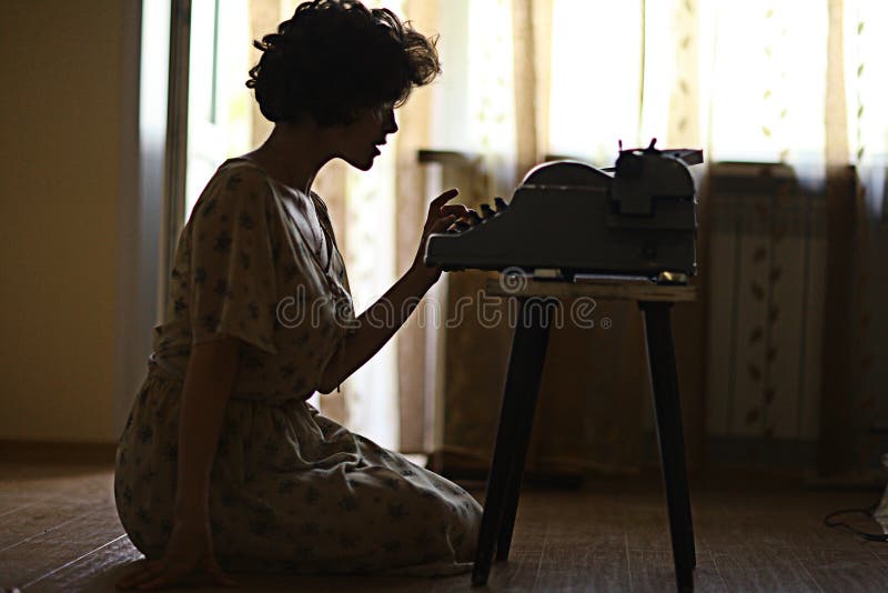 Girl typing on typewriter stock photo. Image of novel - 63541668