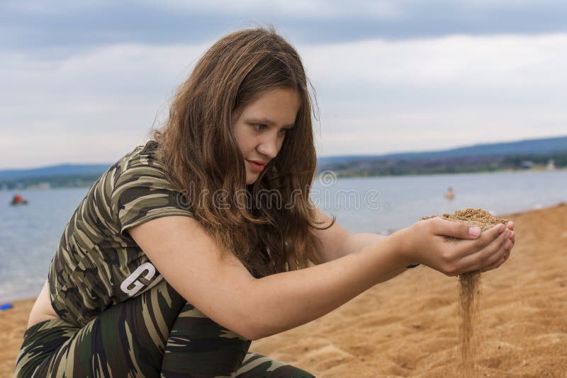The Girl is Under Playing with Sand Stock Image - Image of flow ...
