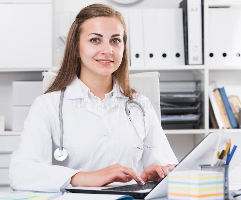 Girl in Uniform is Working Behind Laptop Stock Photo - Image of ...