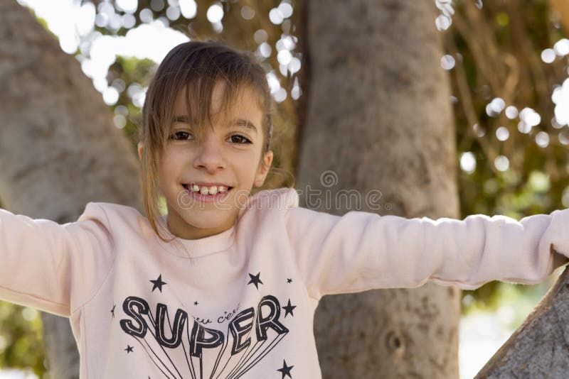 Girl up in a tree. stock photo. Image of game, people - 81856764