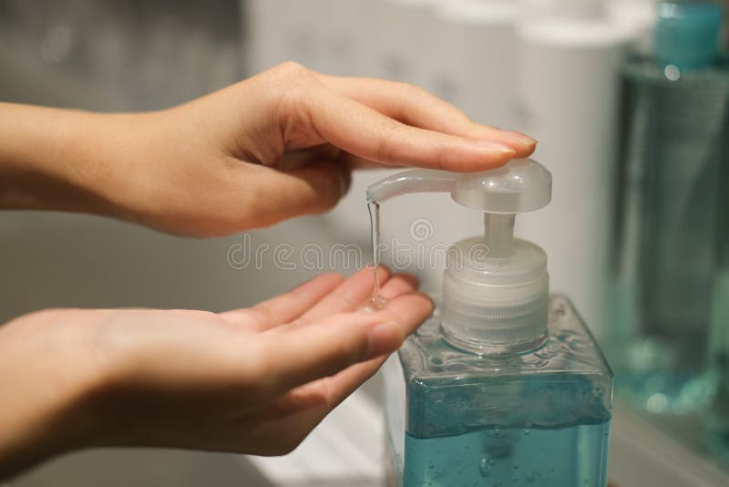 A Girl Using Alcohol Gel for Cleaning Hands Stock Photo - Image of ...