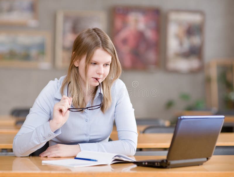 Girl Using Computer in a Library. Stock Image - Image of class, college ...