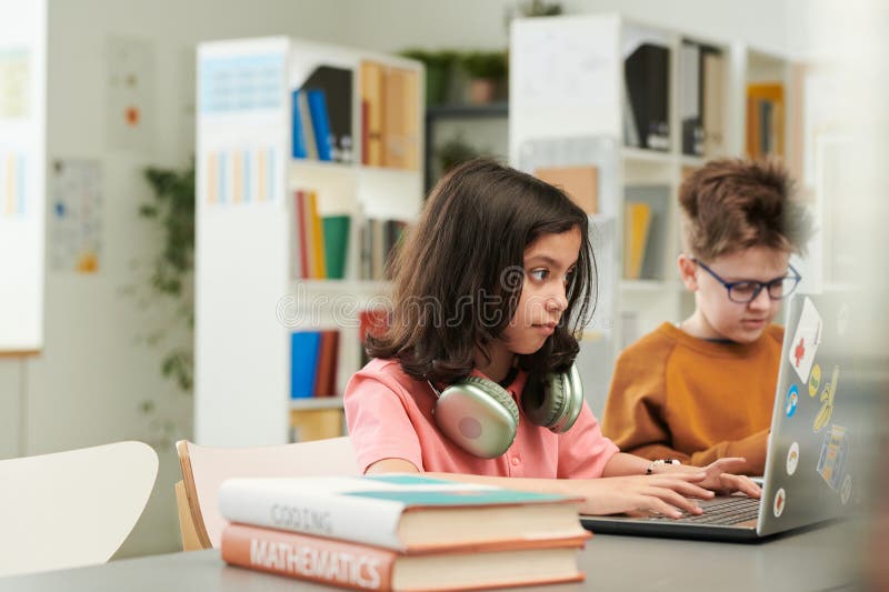 Girl Using Computer in School Library Studying it Stock Image - Image ...