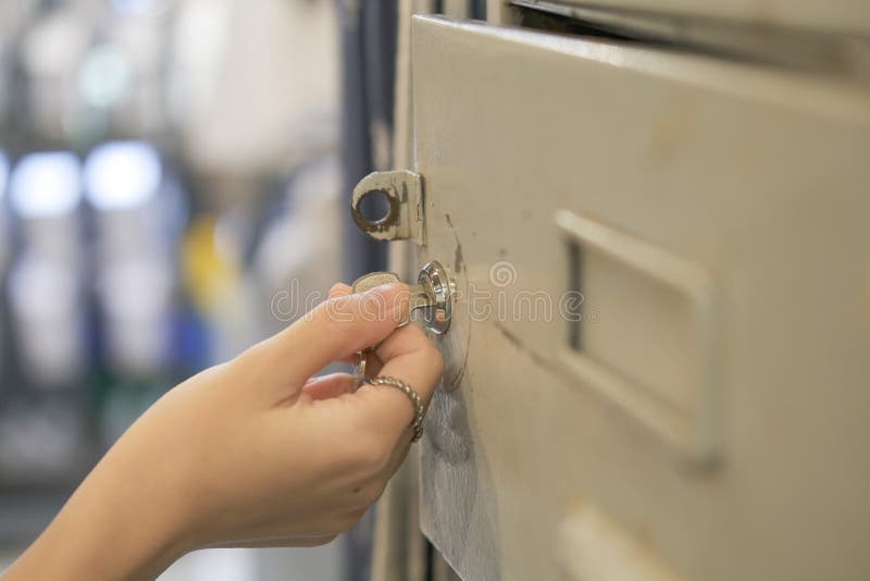 A Girl Using Key for Open the Locker Box Stock Photo - Image of asian ...