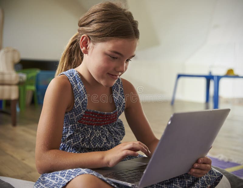 Girl Using Laptop Computer in Playroom Stock Photo - Image of home ...