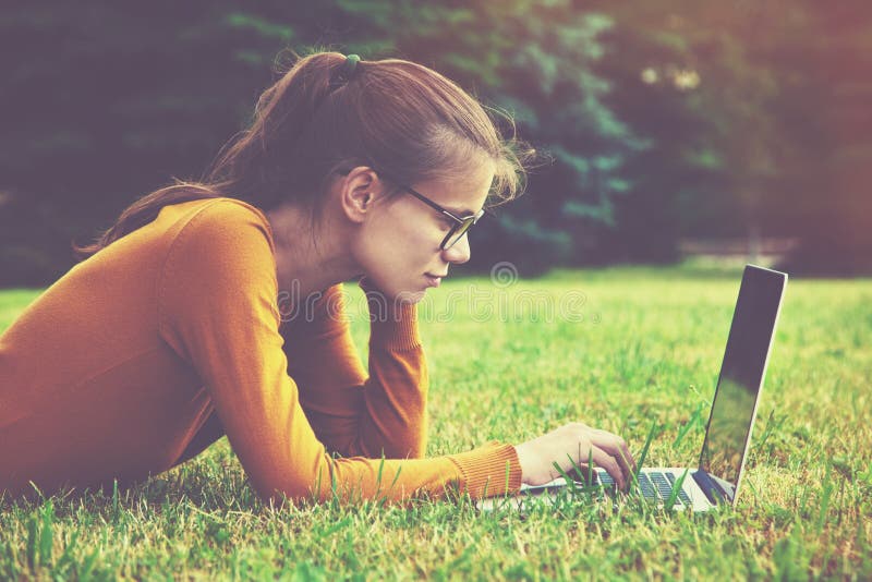 Girl using laptop stock image. Image of nature, computer - 56582763