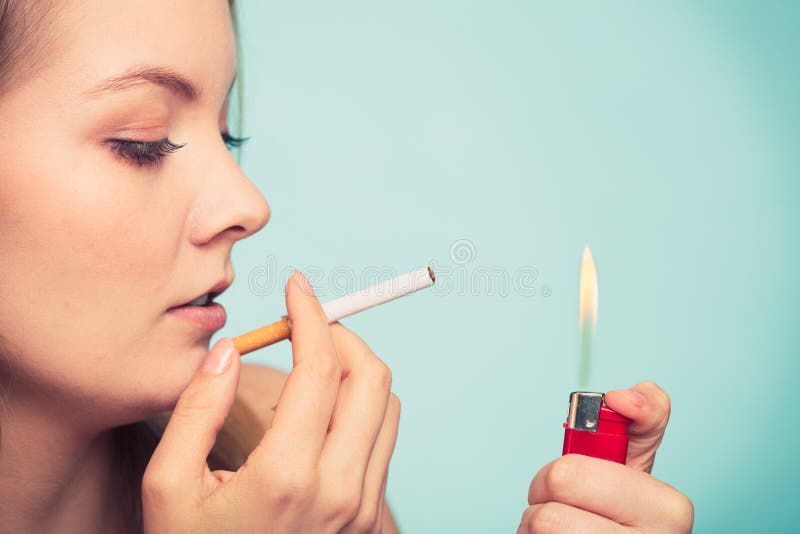 Girl Using Lighter To Light Cigarette. Stock Image - Image of lighter ...