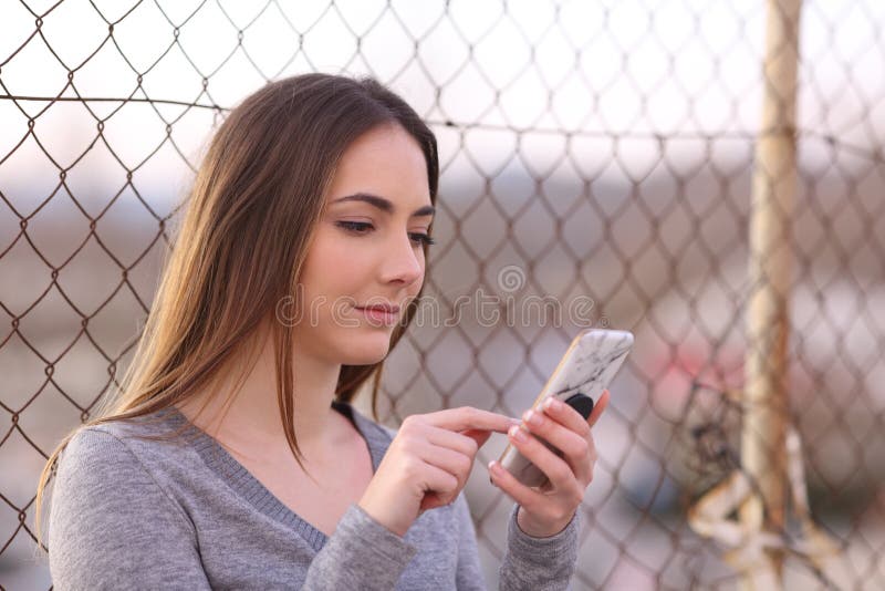 Girl Using a Mobile Phone in the Street Stock Image - Image of hand ...