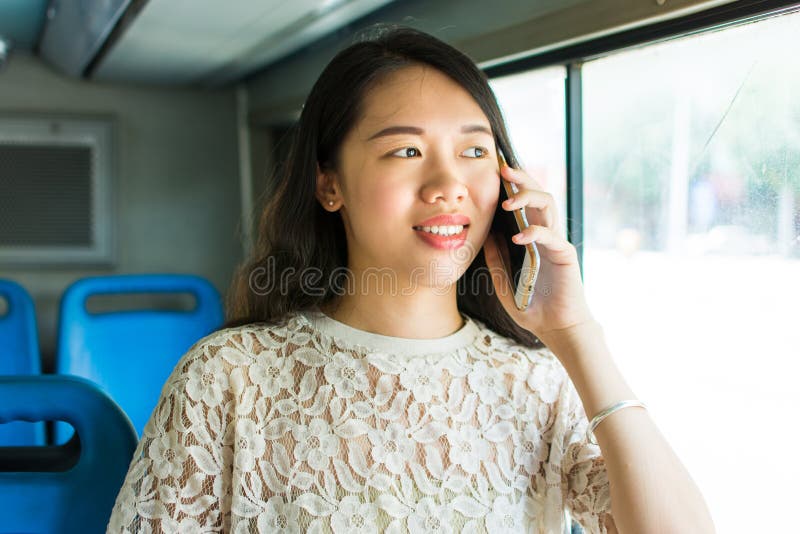 Girl Using Phone on Public Bus Stock Image - Image of call, asian: 96685121