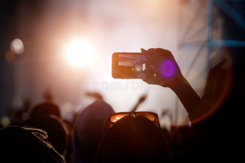 Girl Using Smartphone To Take a Video at a Concert Stock Photo - Image ...