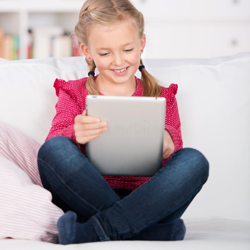 Girl Using Tablet Computer stock image. Image of little - 43965559