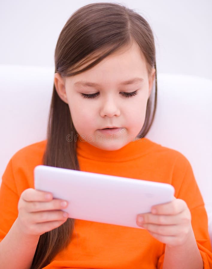 Girl using tablet stock photo. Image of holding, news - 36909684
