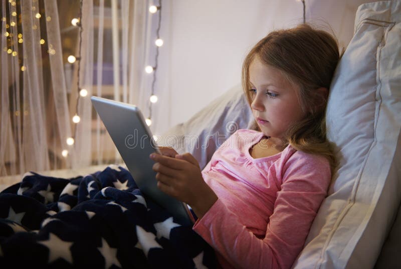 Girl using tablet stock photo. Image of browse, bedtime - 101170702