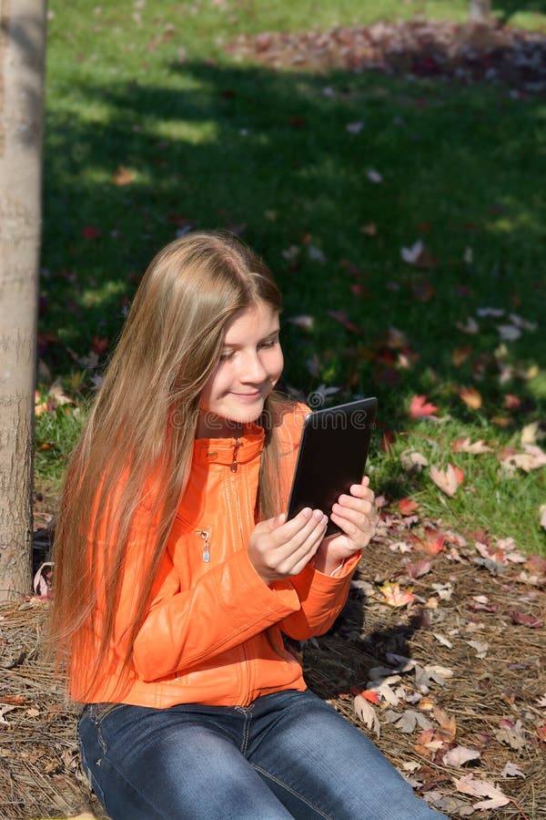 Girl Using Tablet in the Park. Stock Image - Image of connection, child ...