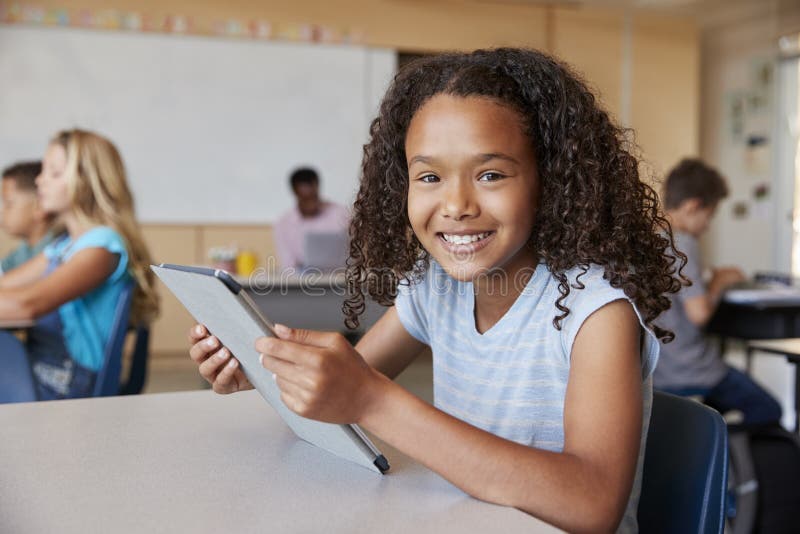 Girl Using Tablet in School Class Smiling To Camera Close Up Stock ...