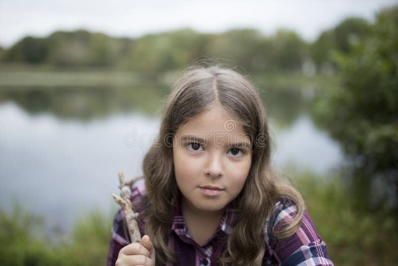 Girl with Very Serious Look in Outdoor Setting Stock Image - Image of ...