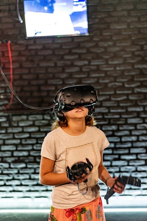 The Girl in the VR Helmet Plays Computer Games Stock Photo - Image of ...