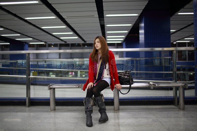 Girl Waiting Someone in the Modern Train Platform in Hong Kong Mtr ... Girl Waiting Someone in the Modern Train Platform in Hong Kong Mtr ...