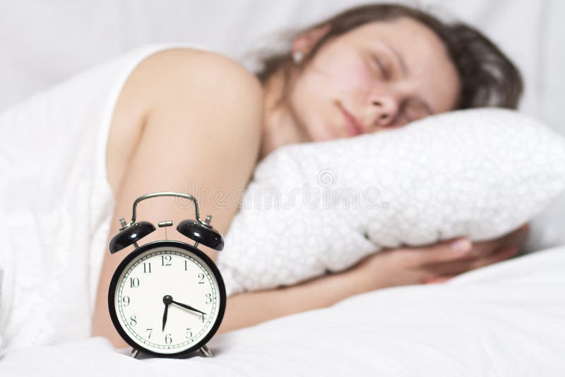 Girl Wakes Up in the Morning Under the Alarm Clock. Stock Photo - Image ... Girl Wakes Up in the Morning Under the Alarm Clock. Stock Photo - Image ...