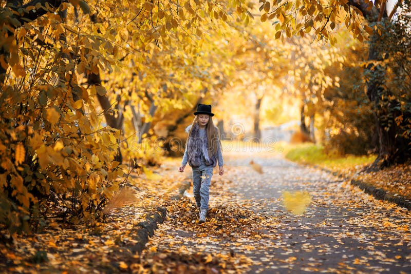 Girl Walking in the Autumn Park. Stock Image - Image of cute, adorable ...