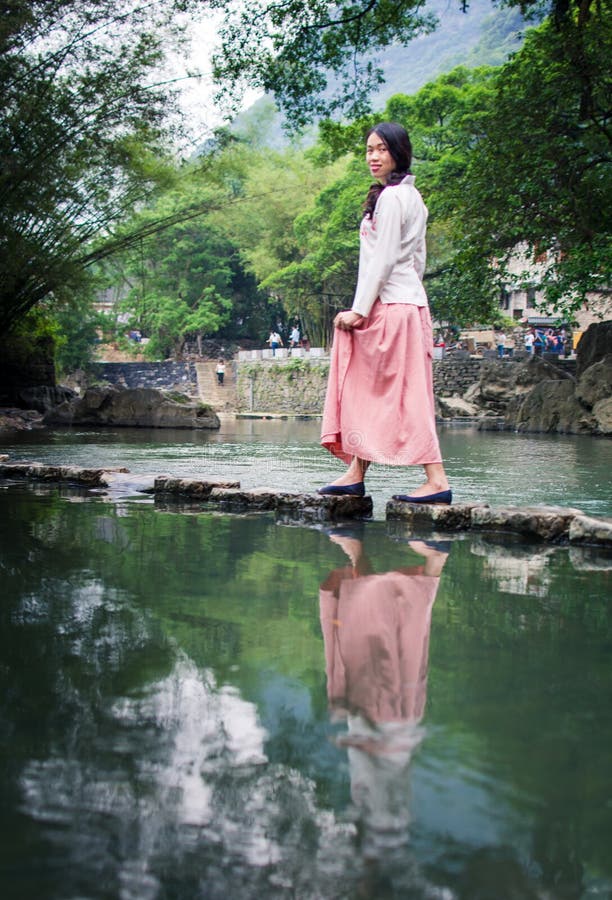 Girl Walking on the Stone Bridge in the River Stock Photo - Image of ...