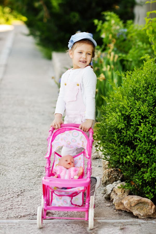 Girl walking with stroller stock image. Image of dall - 74104017