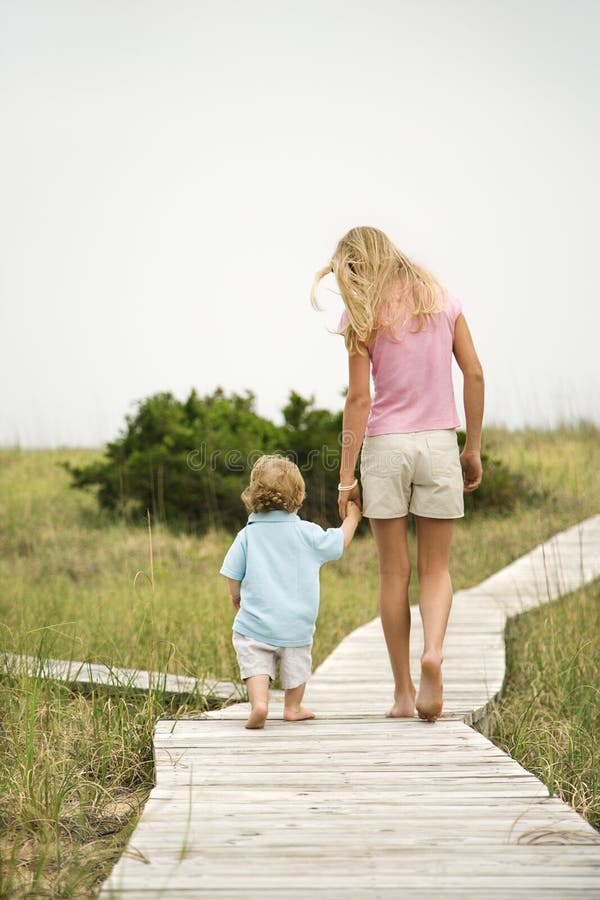 Teen Girl Walking On A Path Stock Image - Image of tall, park: 13824241