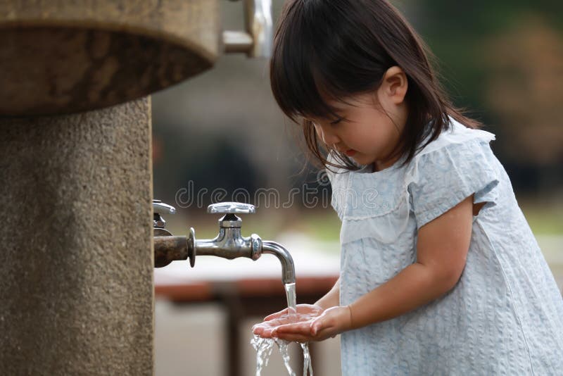 Girl washing hands stock image. Image of girls, lifestyle - 244458015