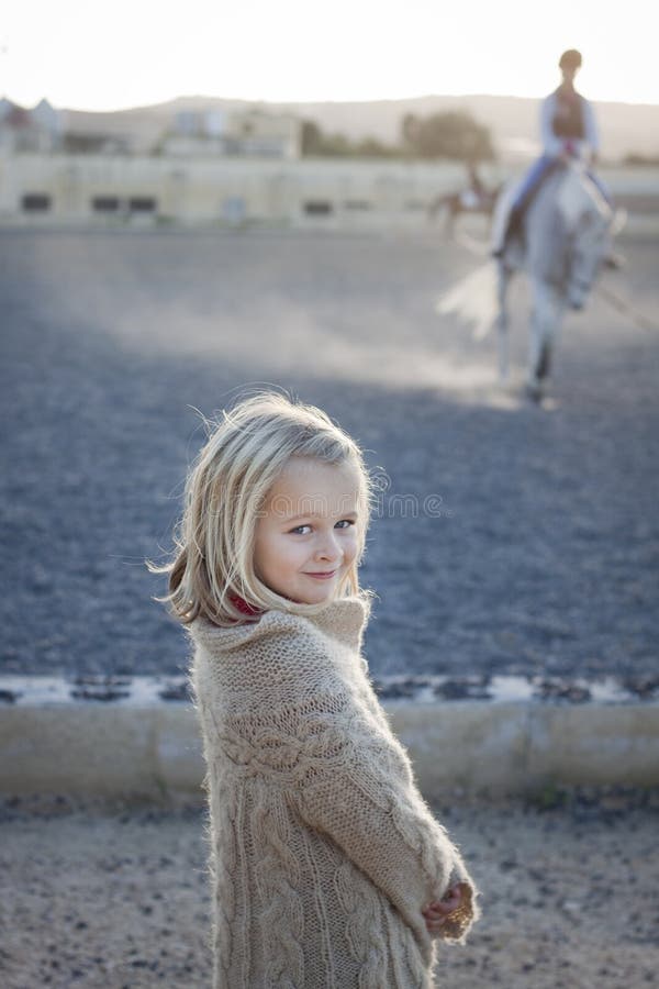 Girl Watching a Riding Lesson Stock Image - Image of cute, horse: 31916303
