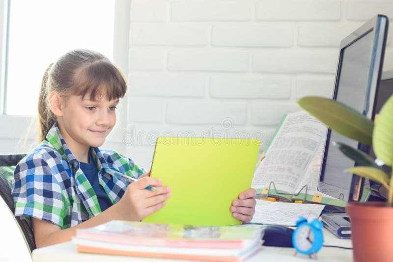 Girl Watching Video Tutorials on a Tablet while at Home Stock Photo ...