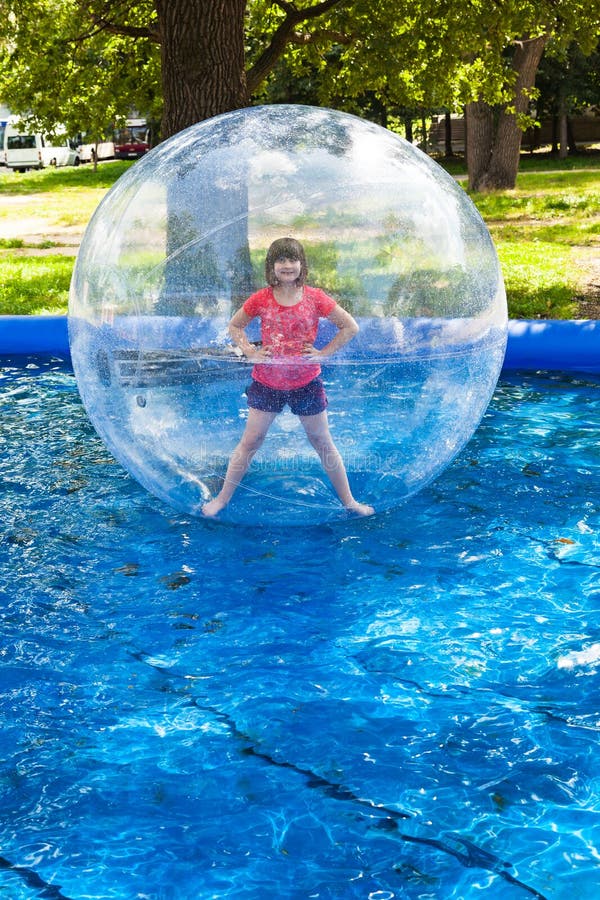 Boy in floating ball stock photo. Image of surface, inflated - 5853434