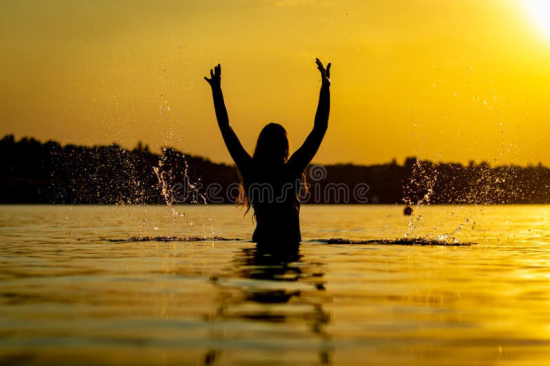Girl in the Water at Sunset Stock Photo - Image of nature, female ...