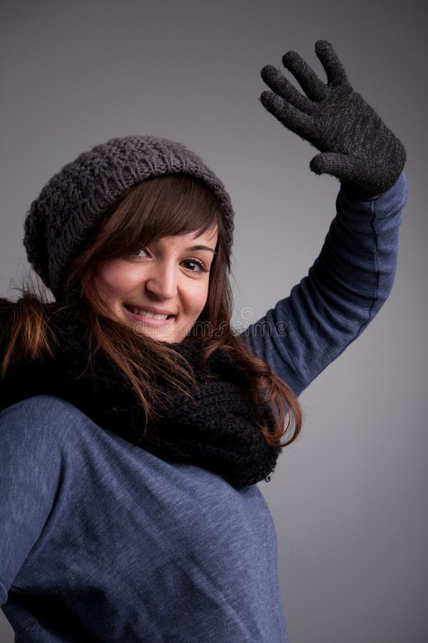 Girl Waving at Camera with Warm Hat Scarf and Gloves Stock Photo ...