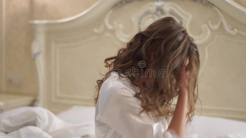 View from the Bottom Up, the Girl Sits Awkwardly with Bare Shoulders ...