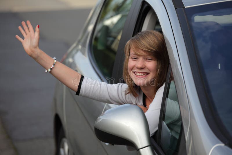 Girl Waving Goodbye from Car Stock Photo - Image of departing, leaving ...