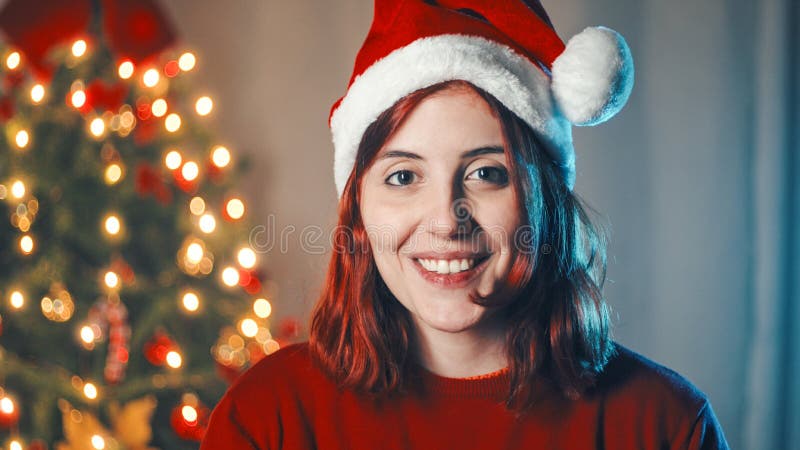 Girl Wear the Christmas Red Hat Against the Tree Stock Photo - Image of ...
