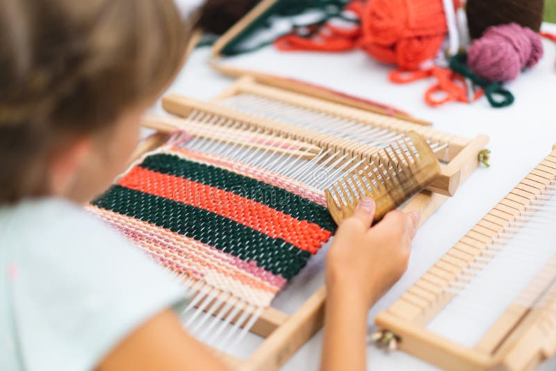 Girl Weaving Small Rug with Pattern at Masterclass on Weaving. Stock ...