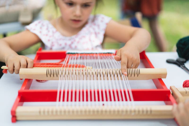 Girl Weaving Small Rug with Pattern at Masterclass on Weaving. Stock ...
