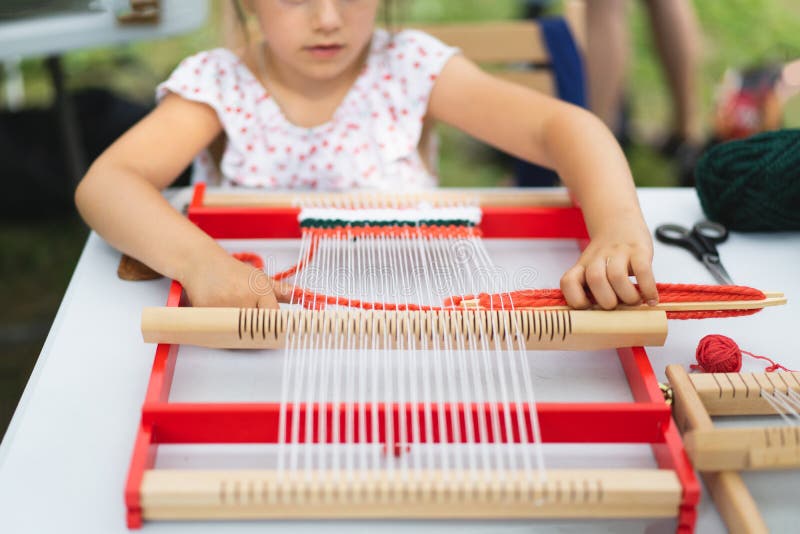 Girl Weaving Small Rug with Pattern at Masterclass on Weaving. Stock ...