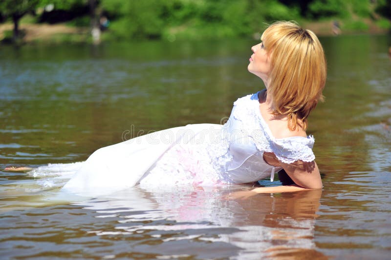 The Girl in a Wedding Dress in Water Stock Photo - Image of fashion ...