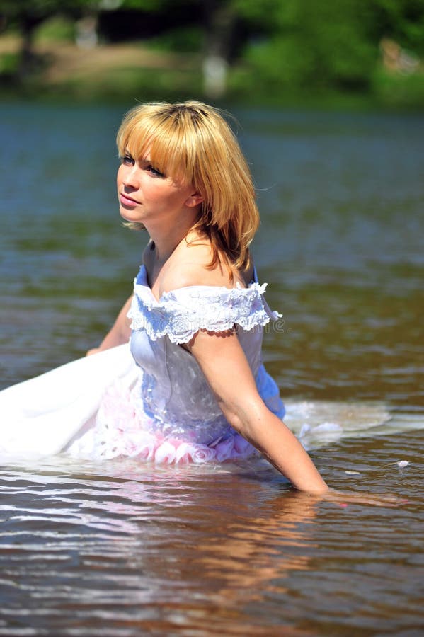 The Girl in a Wedding Dress in Water Stock Image - Image of lovely ...
