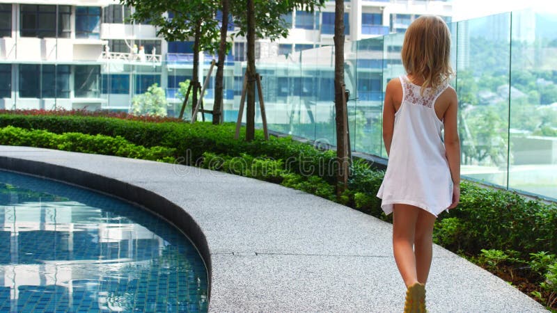A Girl in a White Dress Walking Slowly. Stock Footage - Video of calm ...