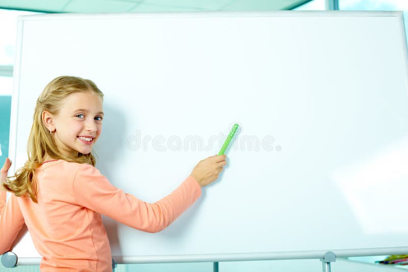 Happy Girl Sitting Pointing at Whiteboard Stock Photo - Image of cute ...