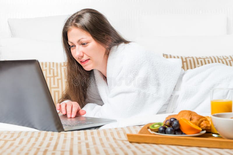 Girl Working on a Computer in Bed Stock Image - Image of caucasian ...