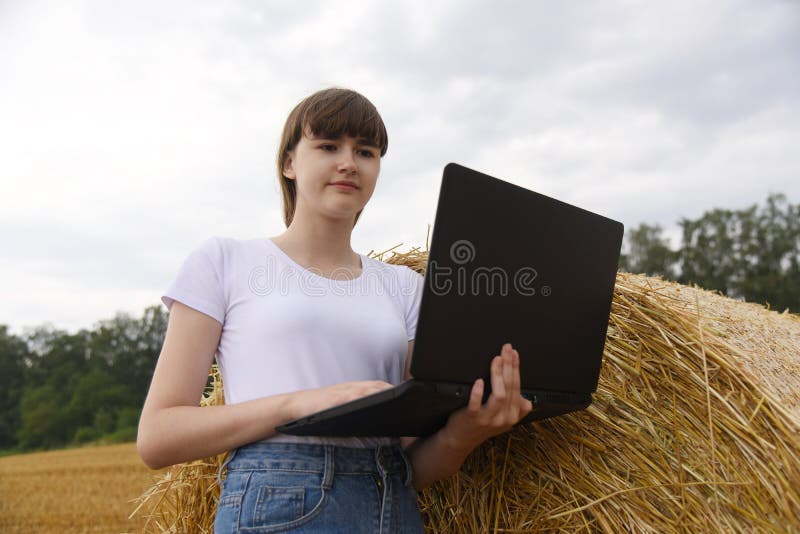 A Girl is Working on a Computer. Stock Photo - Image of face, autumn ...