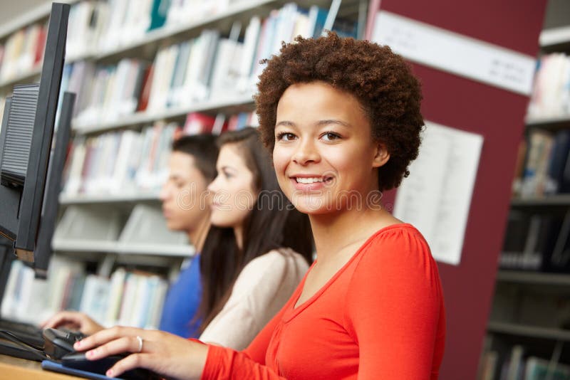 Girl Working on Computer in Library Stock Photo - Image of happy ...