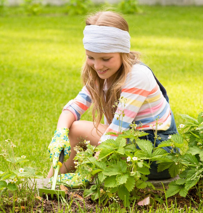 Girl Working in the Garden Grooming Plants Stock Image - Image of ...